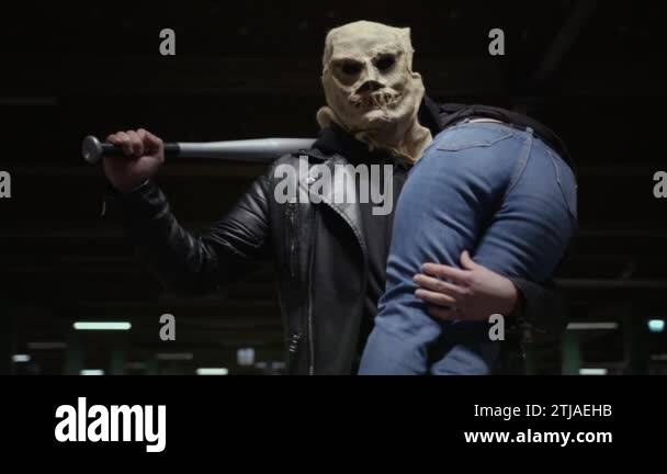 Homicidal maniac on Halloween or Doomsday. Male killer in scary ...