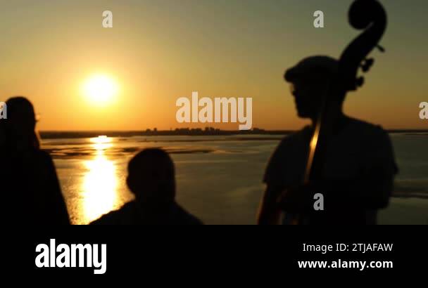 Silhouette scene of musician band, musicians with instrument relaxing ...