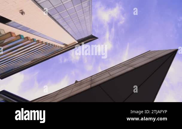 Narrow passage between modern residential buildings. Walls of high-rise ...