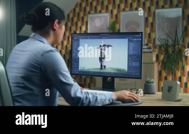 Asian female 3D designer making animation for video game character ...