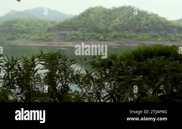 statue of unity board written at green mountain with river at morning ...