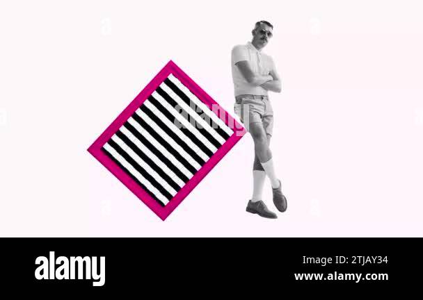 Stylish guy standing near huge foursquare with pattern of optical ...