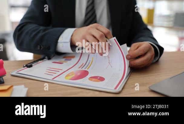 Accountant hands point to business graph charts. Financial business ... Accountant hands point to business graph charts. Financial business ...