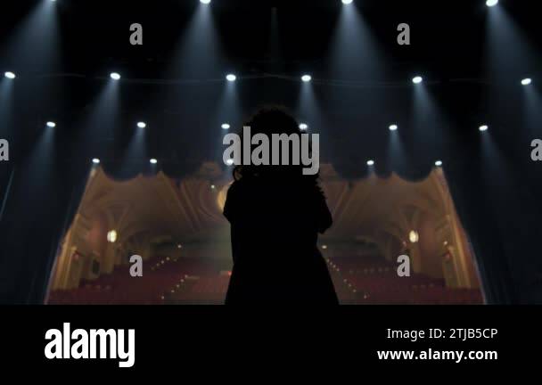 Cinematic Back View of little girl or Actress Going on Stage Under a ...