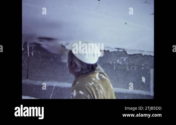 London, United Kingdom may 1972: Bricklayer at work in house interior ...