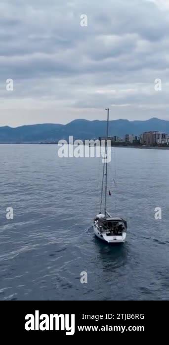 Immerse yourself in the tranquility of a sailing yacht as it makes a ...