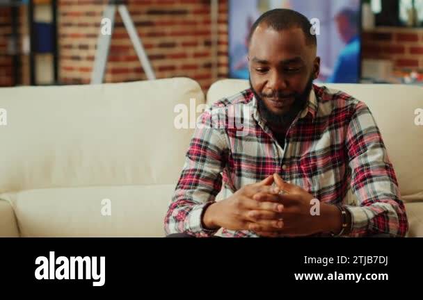 Smiling cheerful person excited to catch up with friends during online ...