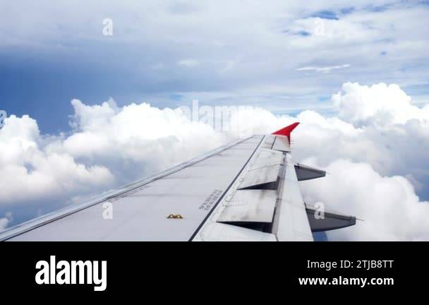 airplane window View of Beautiful Cloud sky with plane wings for travel ...