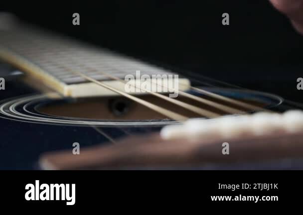 Vibration of strings on an acoustic guitar in slow motion. Classical ...