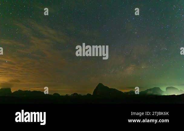 Time lapse amazing night view of nature at night.clouds stars and milky ...