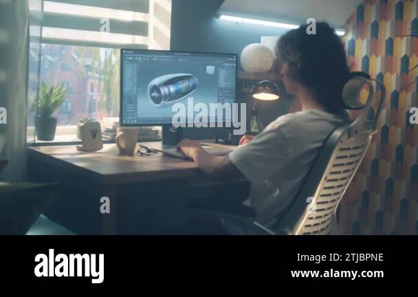 Male young engineer using pc with professional program and creating 3D ...