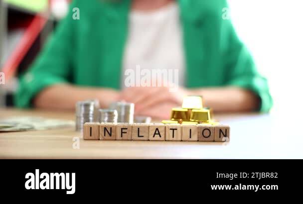 Inflation and economic sanctions gold and stacks of coins. Inflation in ...