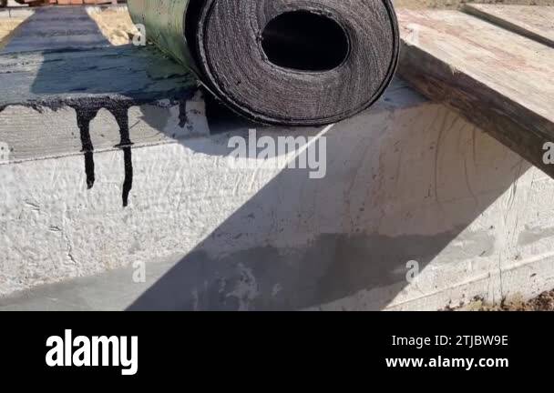 Roll waterproofing of the foundation of the building before the start ...