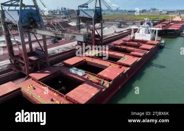 Bulk Carrier Ship Offloading Cargo By Crane for Processing Stock Video ...