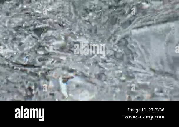 Closeup bubbling aqua texture. Cold water waves moving spinning in ...