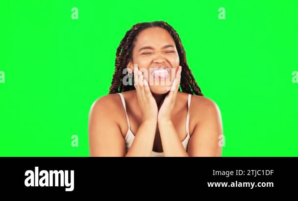 Funny face, laughing and a black woman on a green screen isolated on a ...