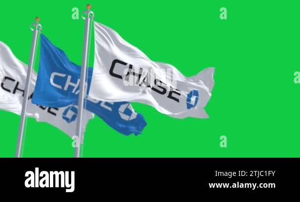 New York, US, March 2023: Flags of Chase Bank waving isolated on a green background.. 3D render ...
