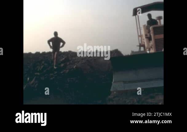 Copenhagen, Denmark May 1966: Crawler tractor plows the land scene in ...