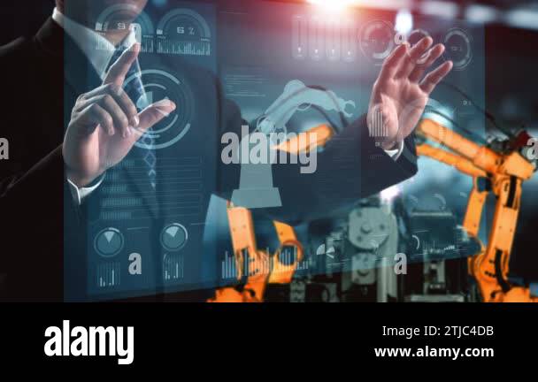 Engineer use cybernated robotic software to control industry robot arm ...