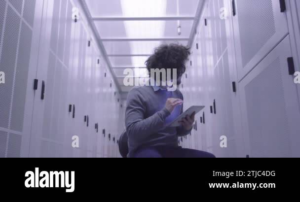 IT engineer or data science specialist working on tablet computer in ...