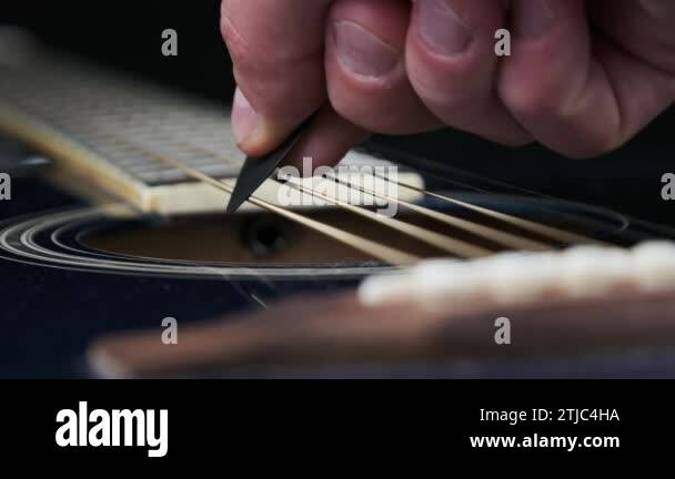 Vibration of strings on an acoustic guitar in slow motion. Classical ...