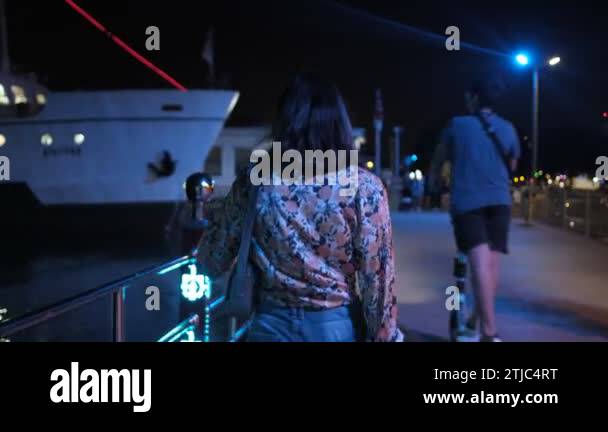 Women Strolling On Night, woman walking in park at night, rest activity ...