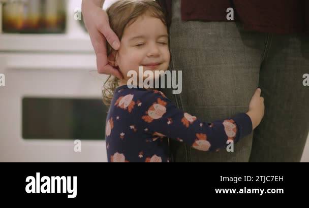 Portrait of a cute 2-year toddler girl going about her daily routine. Shot in 4K on a cinema ...