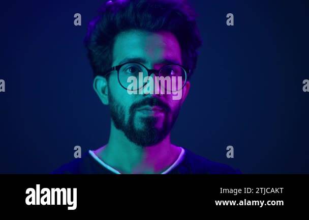 Portrait Indian serious man developer coding worker looking internet ...