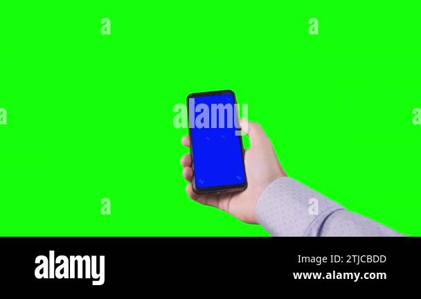 Male hand holding a smartphone with a blue screen and trackers on a ...
