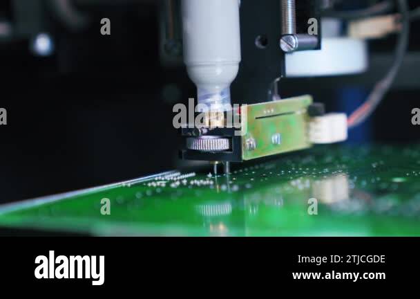 Machine working on surface of PCB printed circuit board putting on ...