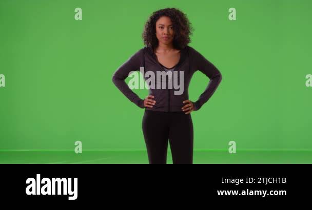 Strong healthy black woman athlete standing with confidence on ...
