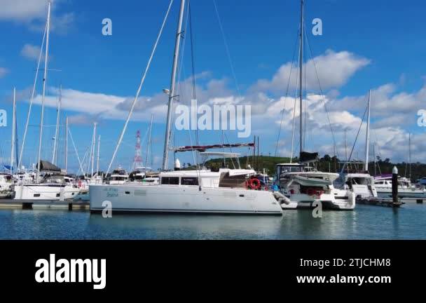 Beautiful white sailing yacht at the pier, sailing catamaran in the ...