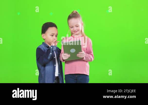 Happy focused children scrolling screen of digital tablet indoors ...