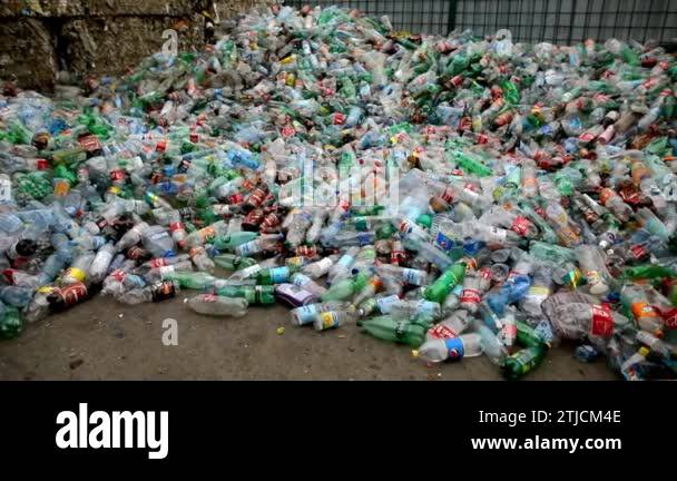 piles of plastic packaging bottles for recycling waste to be reused as ...