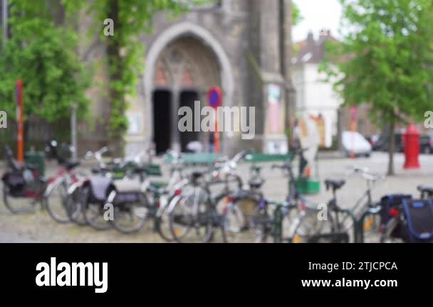 Out of focus background plate of street in front of church in Bruges ...