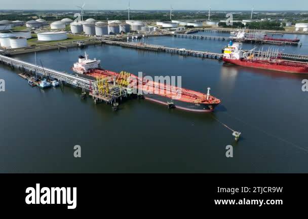 Liquid Cargo Transporter Ship Unloading Crude Oil to a Fuel Depot Stock ...