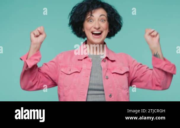 Slow motion excited 40s mature woman with curly hair screaming loud ...