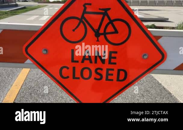 Lane closed sign on the road not allowing bicycles to pass Passage ...