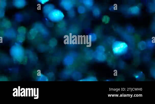 Golden glitter background. Beautiful transition with real gold particles. flying in wind on ...