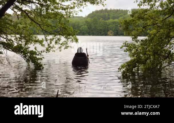 Grim Reaper In Black Hooded Cloak With Scythe Walks And Submerges Into ...