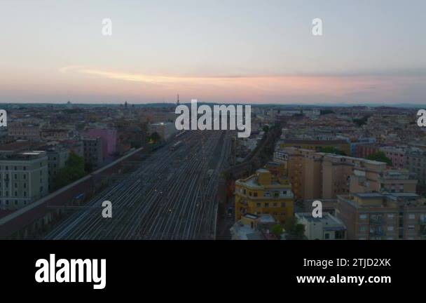 Aerial slide and pan footage of wide railway body with multiple tracks ...