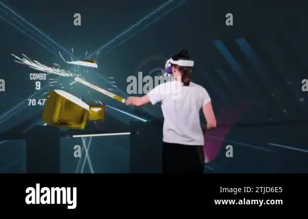 Woman in a virtual reality headset plays an action video game in ...