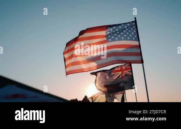Flags of different countries beautifully fluttering in the wind against ...