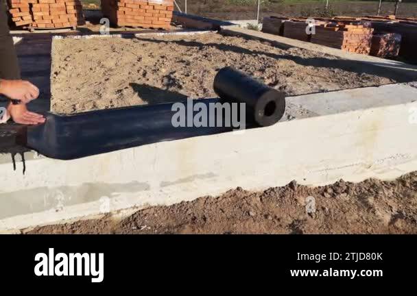 Roll waterproofing of the foundation of the building before the start ...