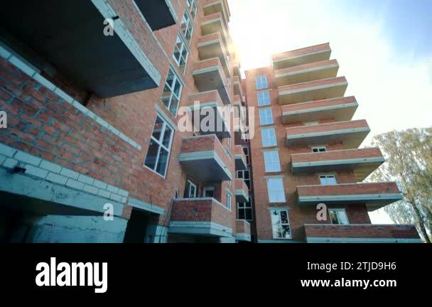The exterior of a brick house without a facade. Multi-storey building ...