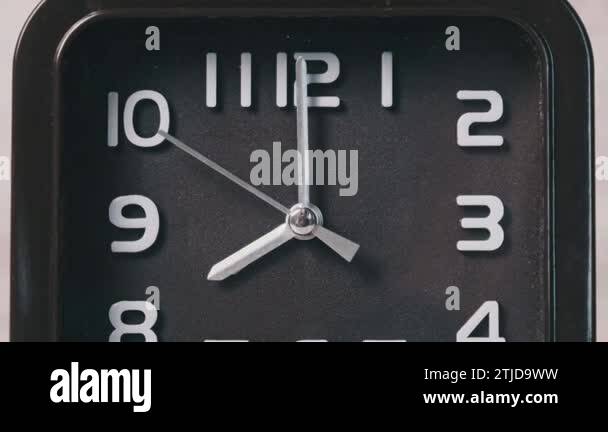 The pointer clock on wooden table shows time 8 oclock. Arrow brown ...