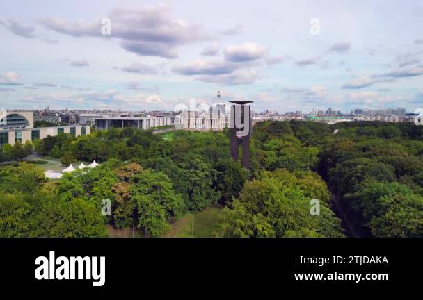 boom slide to left drone of a park in Government district Berlin ...