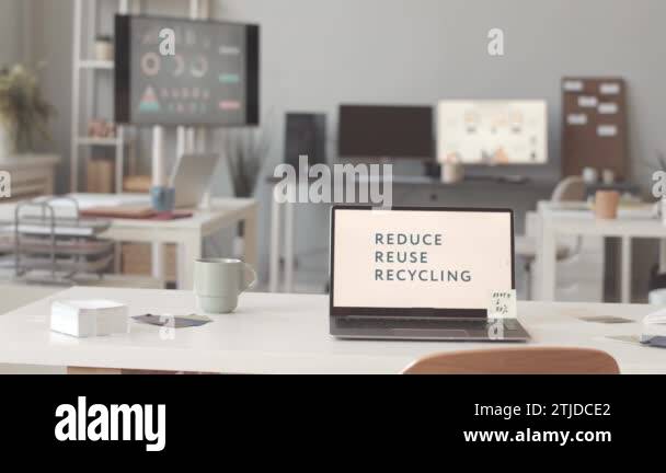 No people slowmo of laptop with Reduce Reuse Recycling lettering on ...