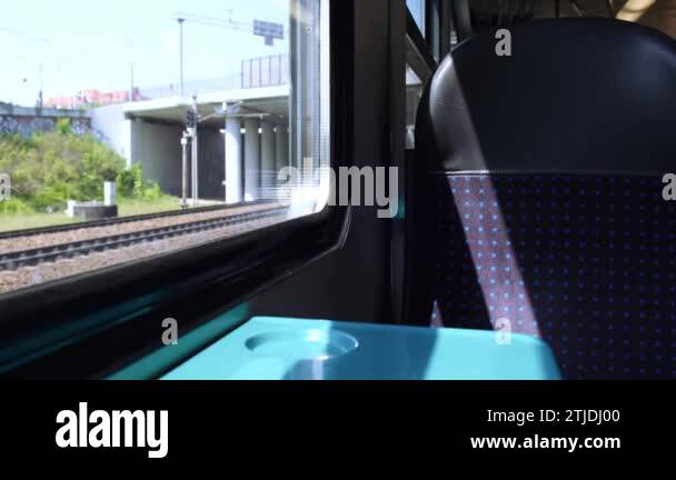 View on railroad track from the window of fast train. 4K Interior view ...