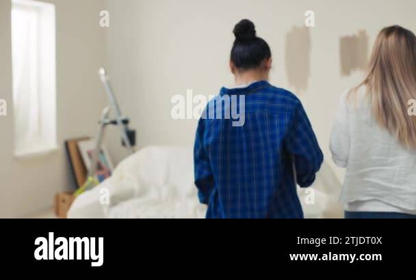 A lady architect brings a potential client to a property for sale. The ...